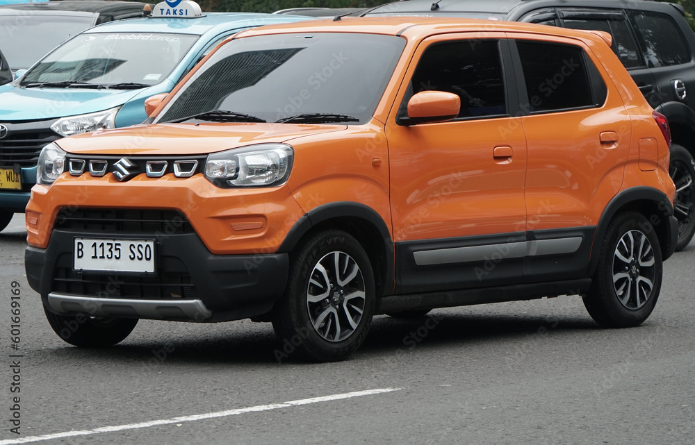 Fotografia do Stock: Compact City Car with Sizzle Orange colour, Suzuki ...