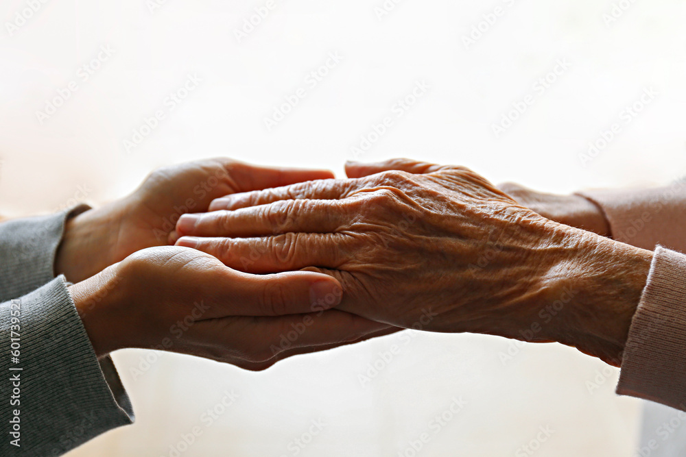 Cropped studio shot of elderly woman and female geriatric social worker ...