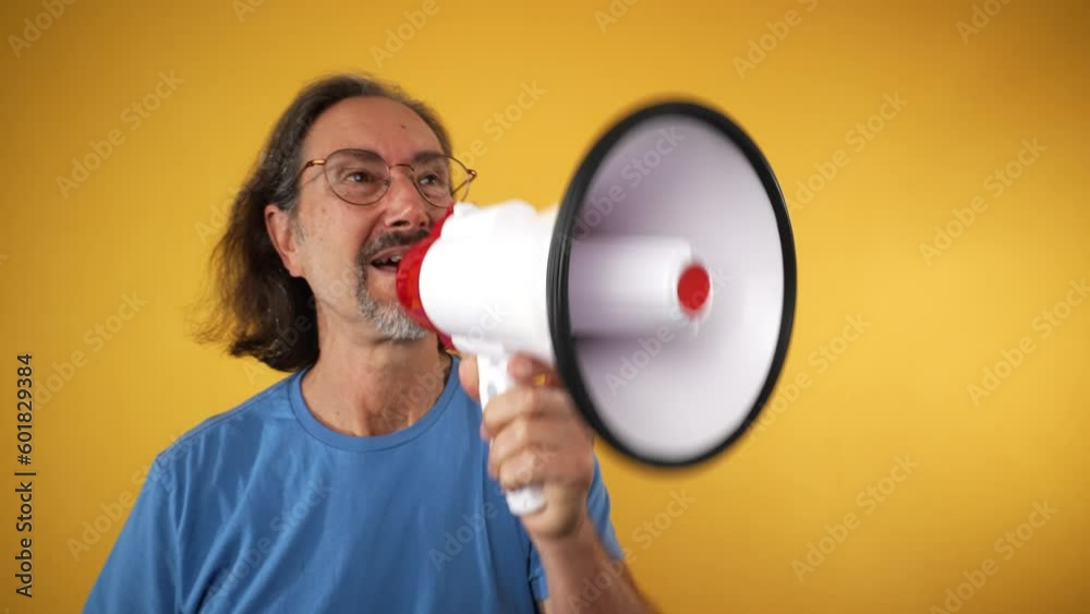 Wide angle, distorted portrait of mature man with glasses yelling into ...