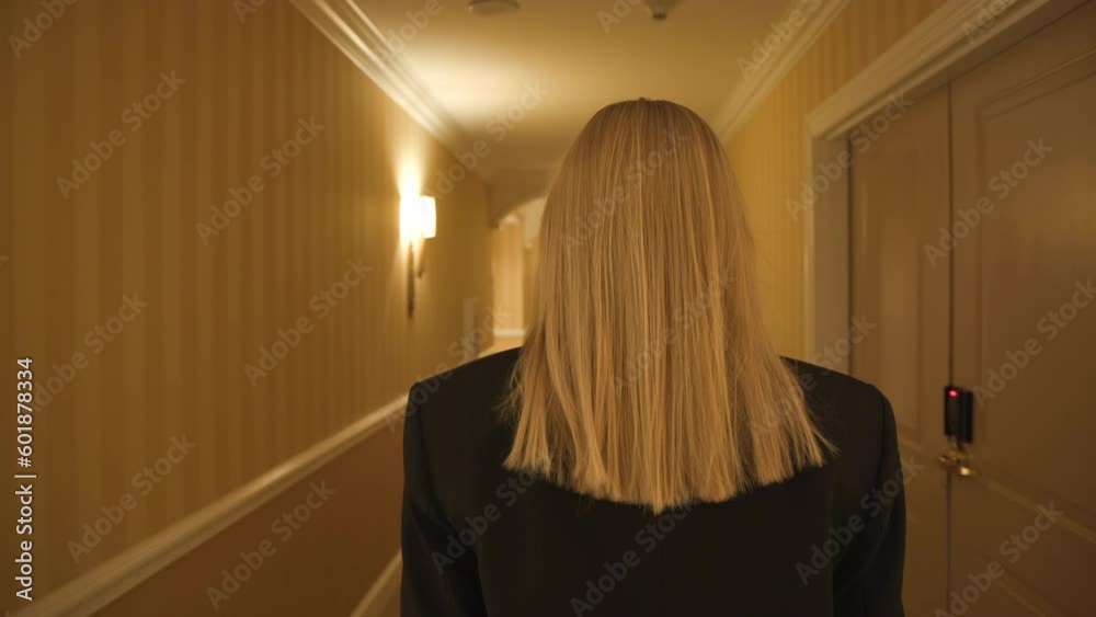 Back view of formally dressed female girl in Luxury modern room ...