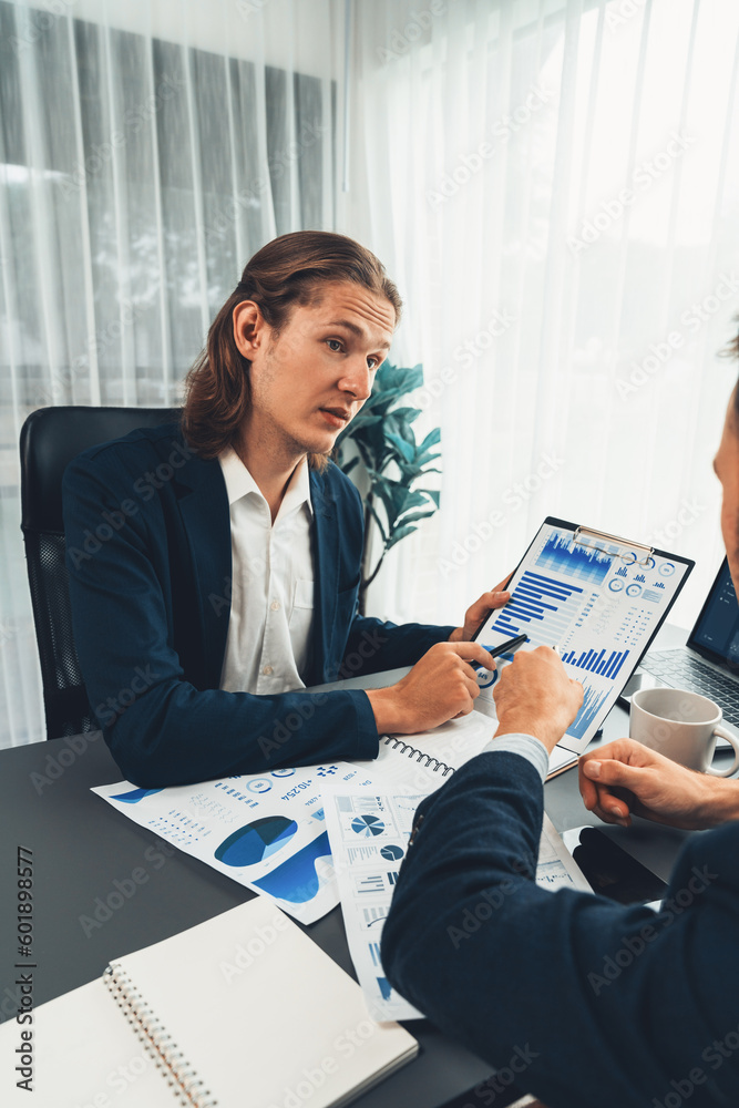 Busy analyst team in office analyzing financial data analysis for ...