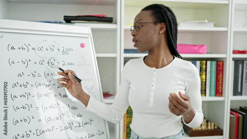 African american woman teacher teaching maths lesson at university ...