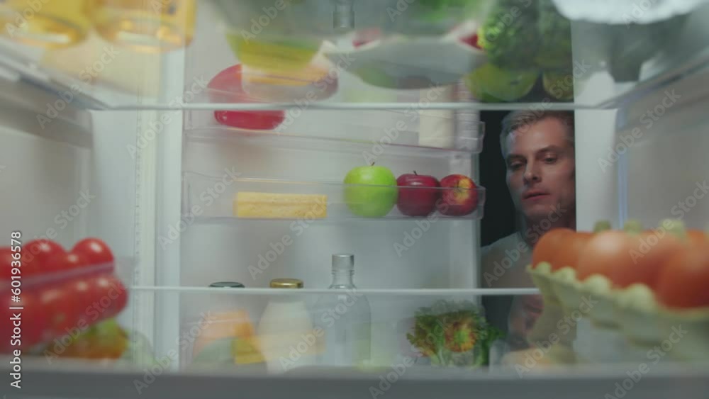 Man Opening Fridge Door with Healthy Food and Taking Products. Hungry ...