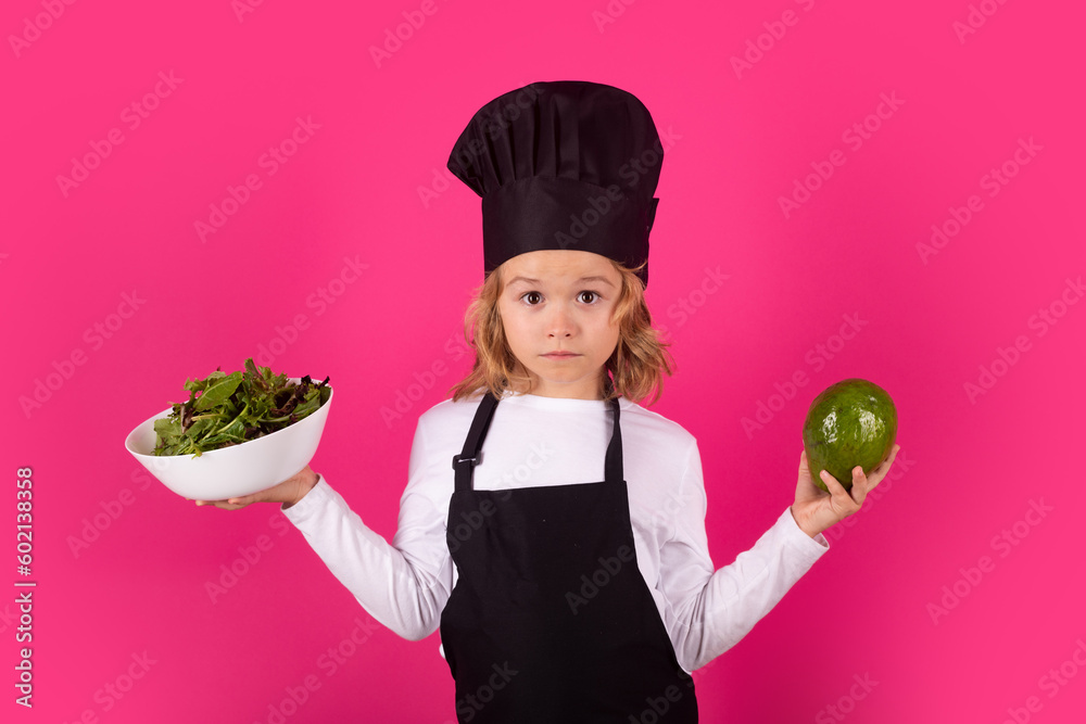Funny child cook with avocado and vegetable. Cooking children. Chef kid ...