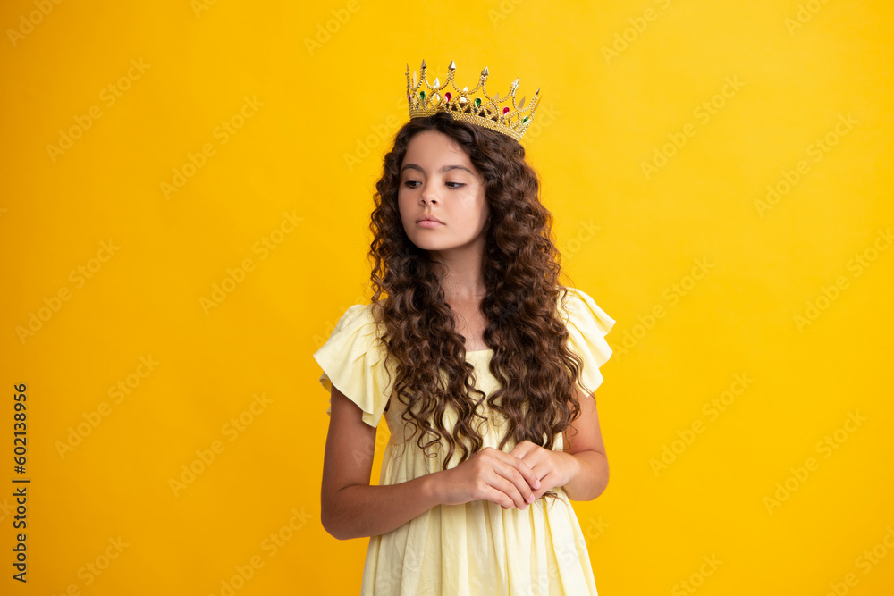 Little queen wearing golden crown. Teenage girl princess holding crown ...