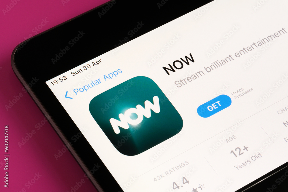 NOW streaming app seen in App Store on the screen of ipad. Selective ...