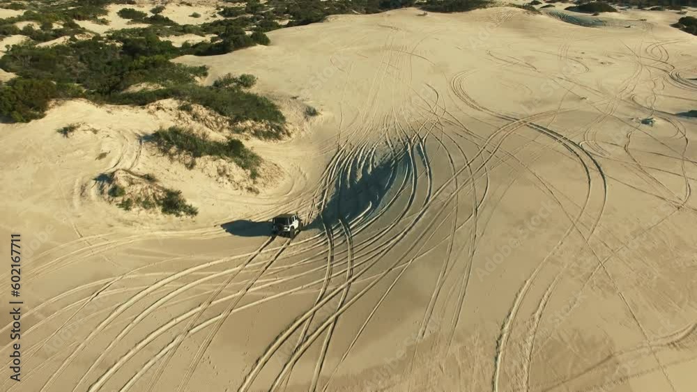 Drone, desert sand and suv car driving in nature, landscape or safari ...