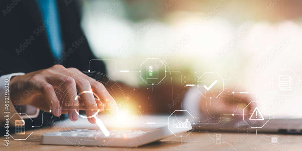 Businessman using a calculator to calculate numbers,Analyzing and ...