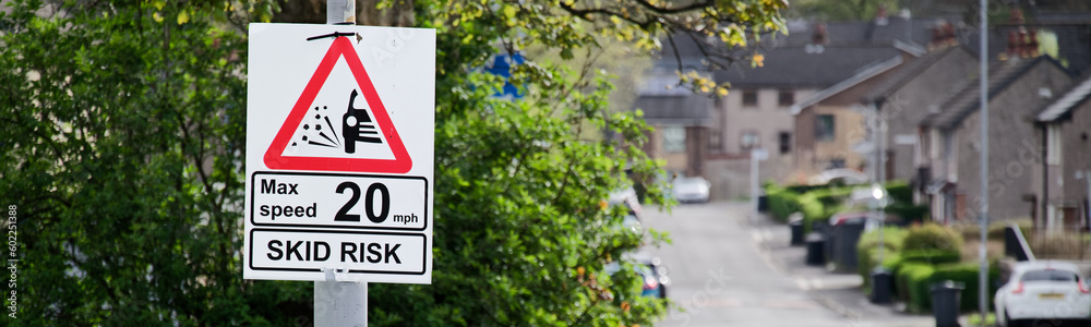 Skid risk road speed limit safety sign Stock Photo | Adobe Stock