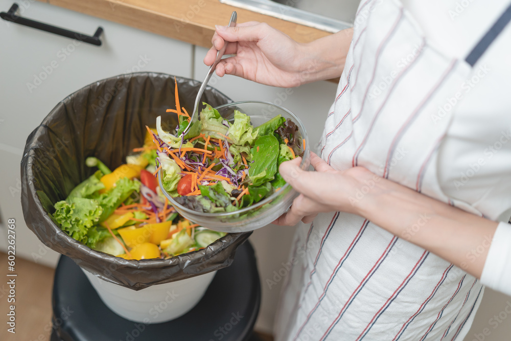 Food waste environment concept, people throwing food garbage into bin ...