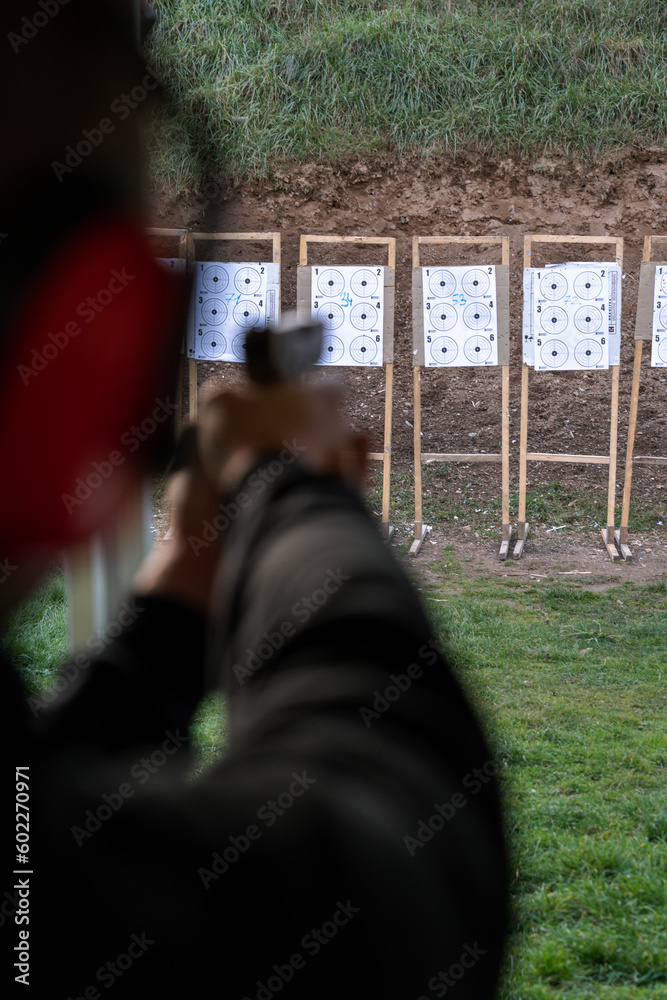 Training shooting weapons at an outdoor shooting range. Stock Photo ...