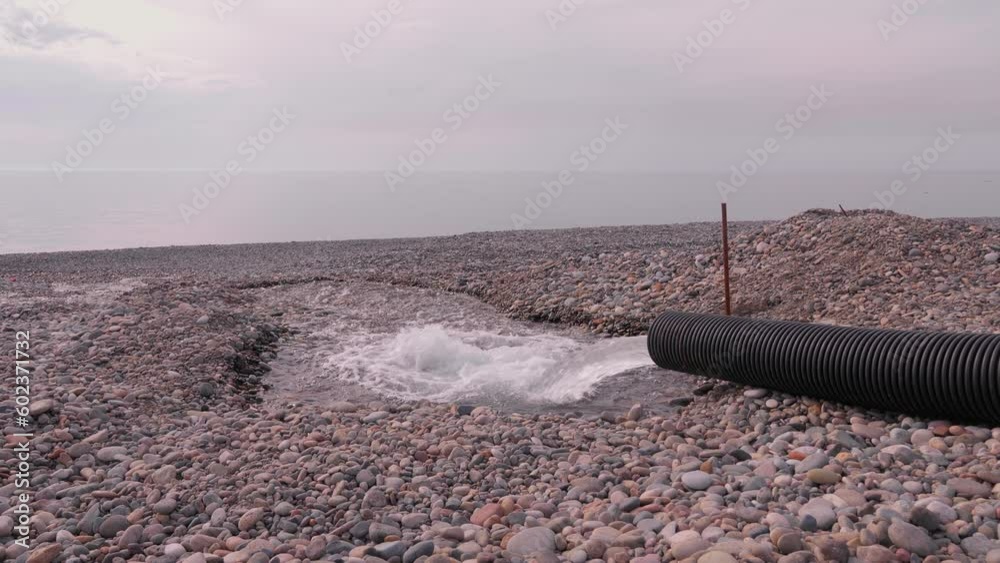 Pollution of sea and ocean . Ecology. Sewage from sewer pipe on beach ...