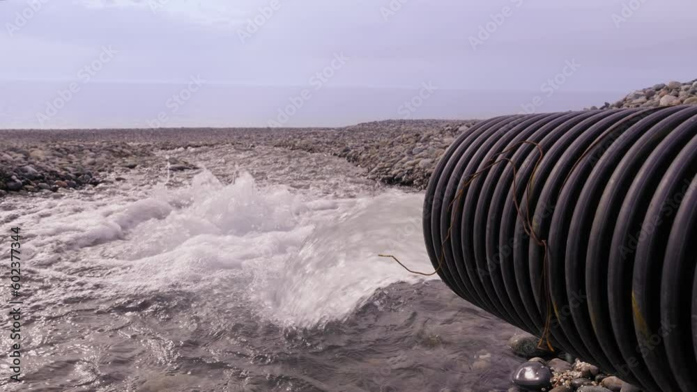 Pollution of sea and ocean, mountains. Ecology. Sewage from sewer pipe ...