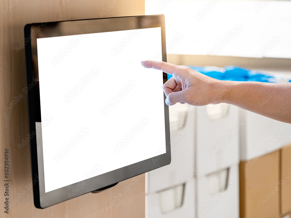 Using interactive touchscreen display in shopping mall. Male customer ...