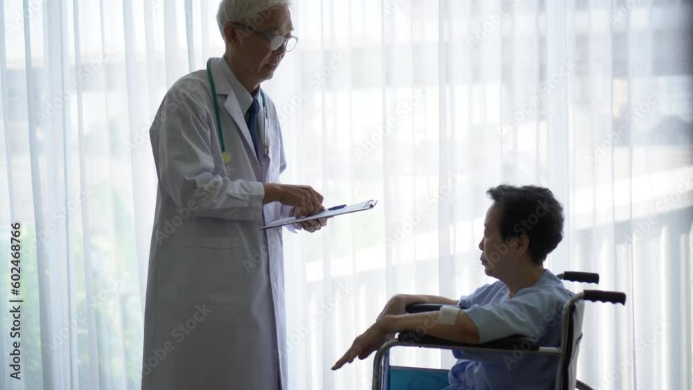 Aging society senior doctor talking to wheelchair woman patient worry ...