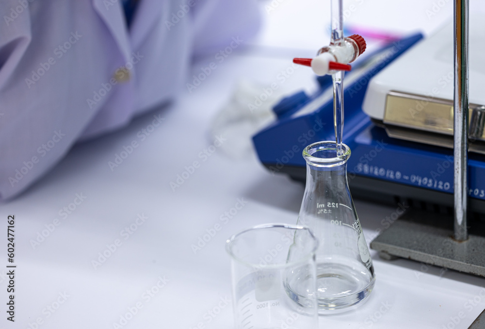 Acid-base reaction titration in Laboratory. Stock Photo | Adobe Stock