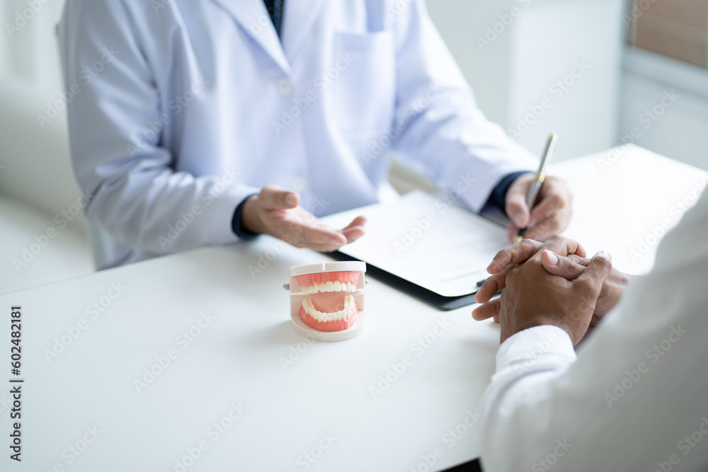 dentist and patient discussion about planned teeth treatment in dental ...