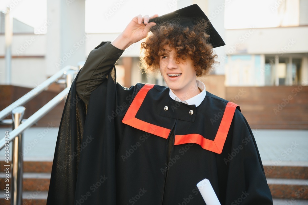 Graduation from university. Young smiling boy university graduate in ...