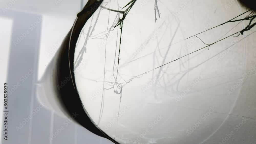 A close-up view of a filter duct in an office building reveals dust ...