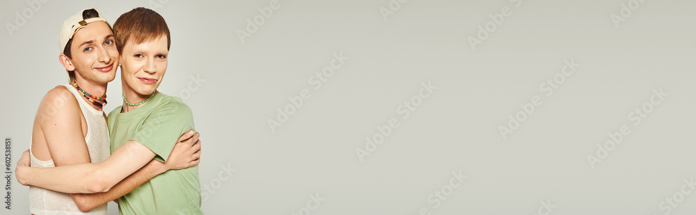 happy lgbt friends hugging and supporting each other while celebrating ...