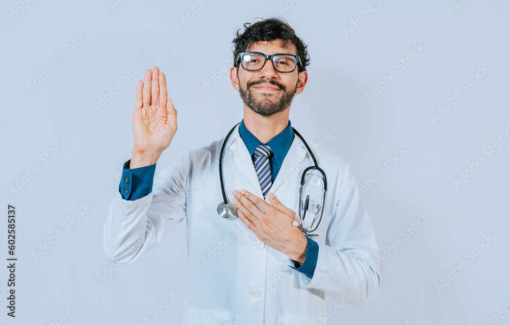 Doctor raising hand and swearing. handsome doctor making oath and ...