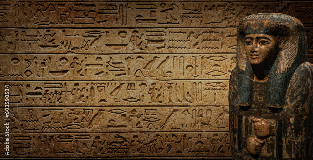 Sarcophagus with an Egyptian mummy on old Egyptian hieroglyphs. Ancient ...