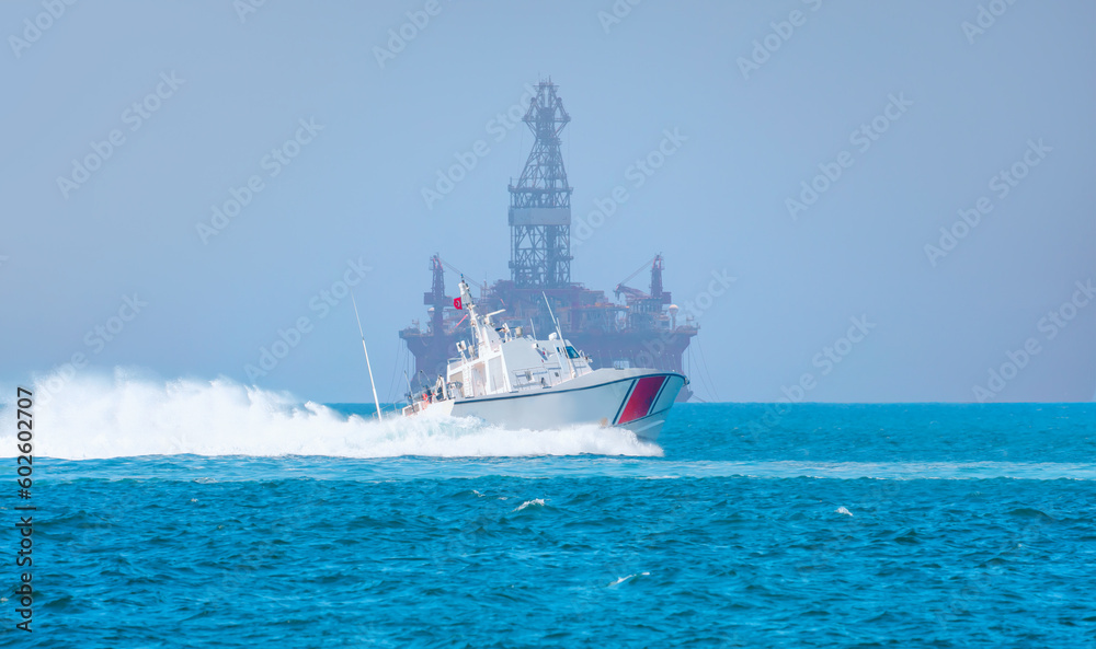 Coast Guard patrol boat rushing to the rescue - Oil and gas wellhead ...