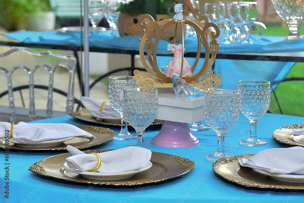 table set for a party, tables decorated with cinderella's carriages, themed party decor ...
