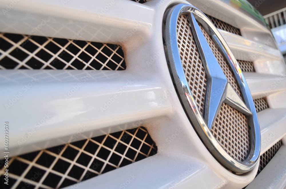 Mercedes Benz logo. Chrome logo on the grill of a Mercedes Benz truck ...