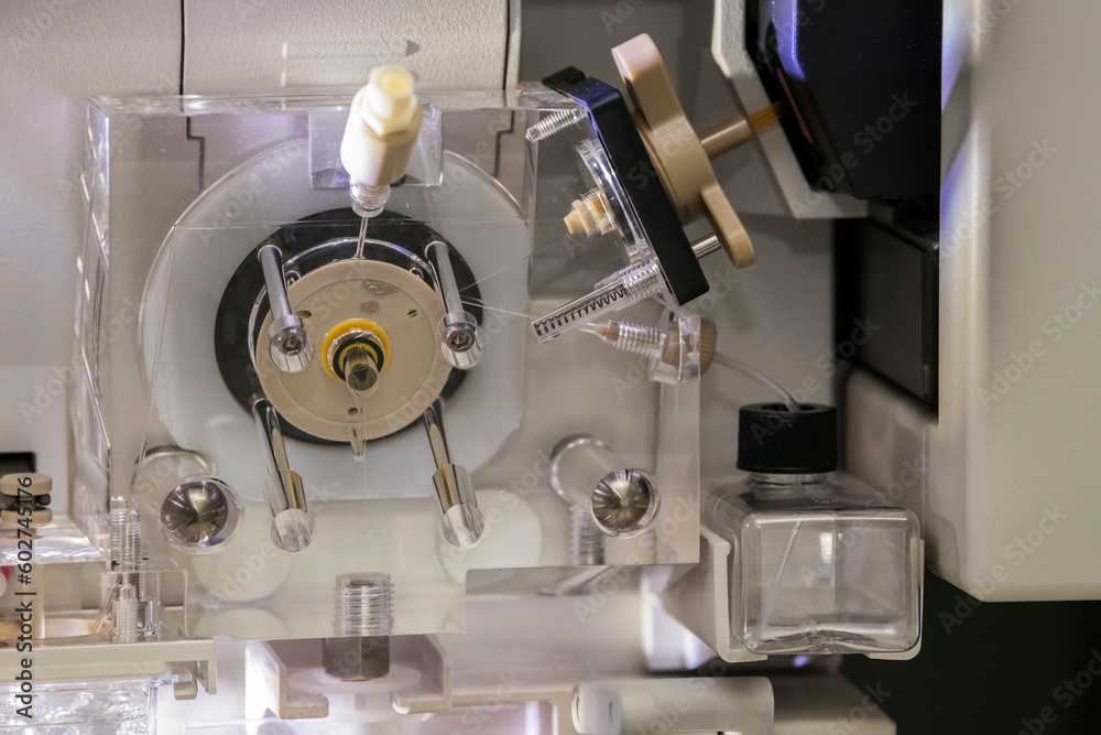 Detailed view of a transparant polymer pump on a sanger genetic ...
