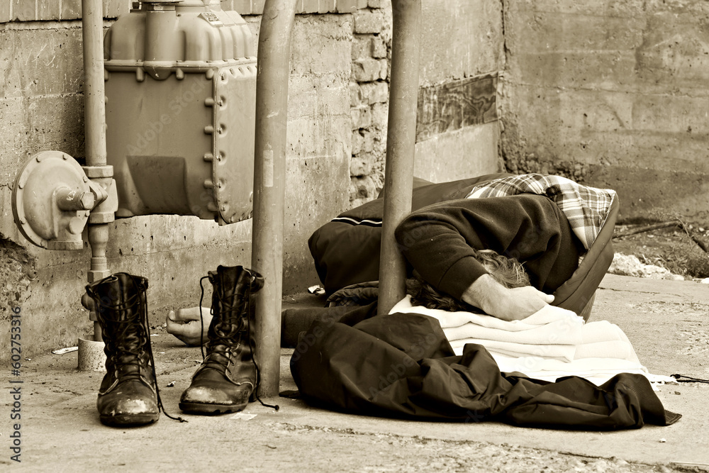 homeless man, sleeping in an alley. converted to add to mood of the ...