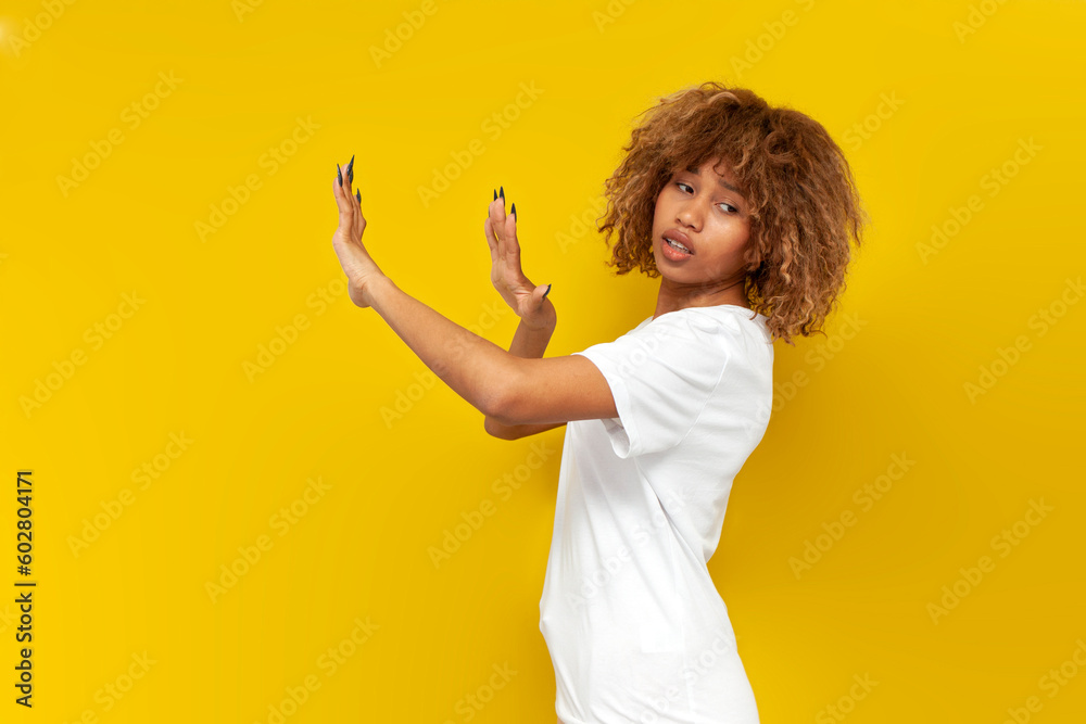 young curly american girl refuse and avoid with hands on yellow ...
