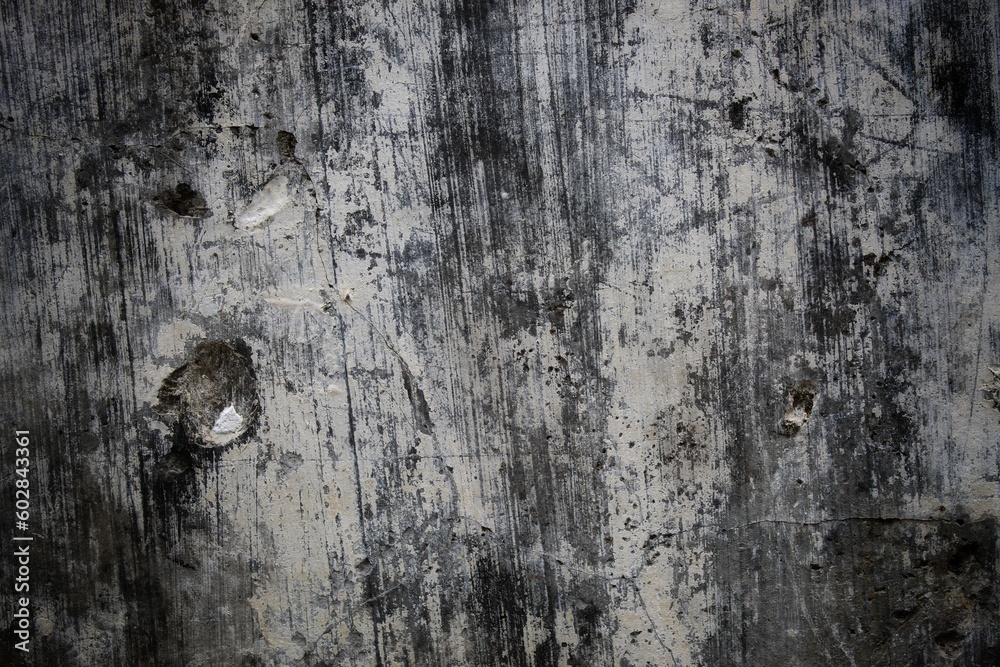 This close-up of a weathered, rundown wall displays the deterioration ...