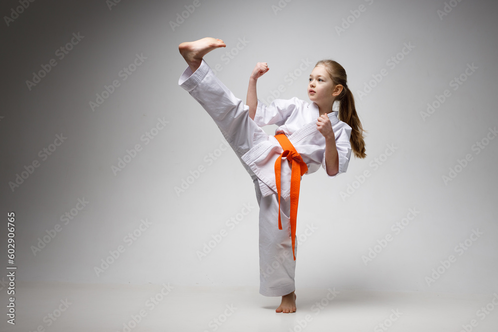 Strong kick in karate training, sporty little girl. Stock Photo | Adobe ...