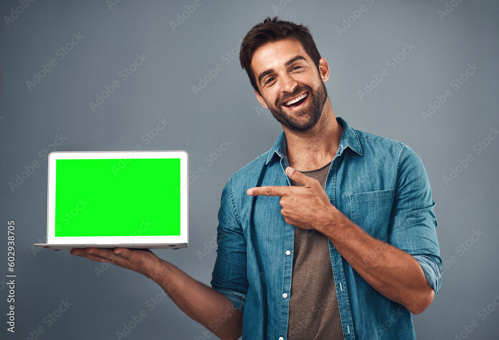 Happy man, tablet and pointing to green screen for advertising against ...
