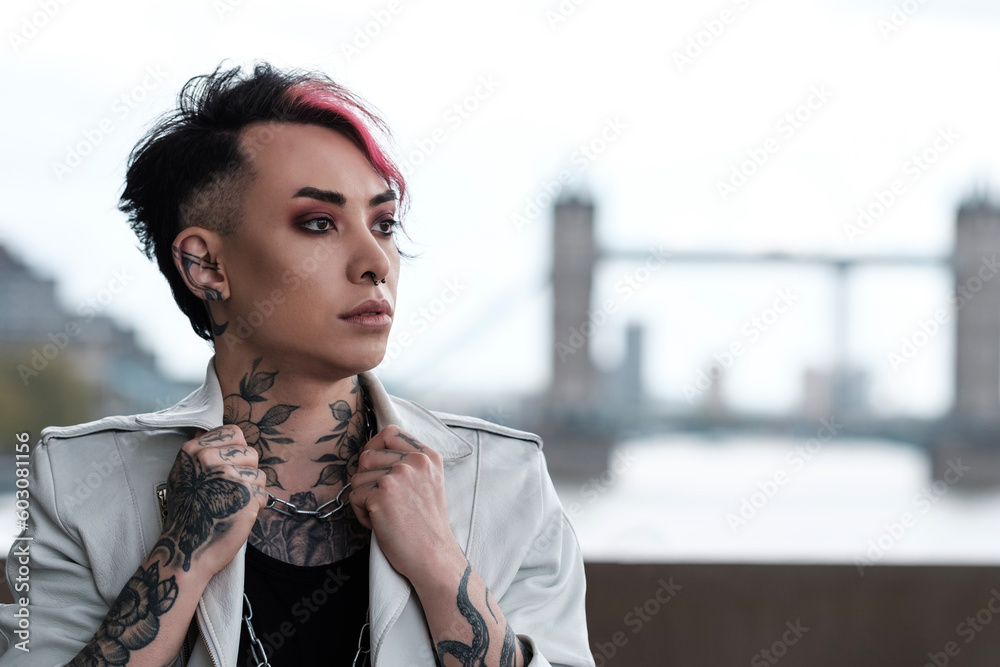Non-binary male with Tower Bridge London like a background. Stock Photo ...