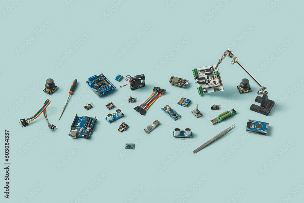 PC hardware components, various tools and wires. Stock Photo | Adobe Stock