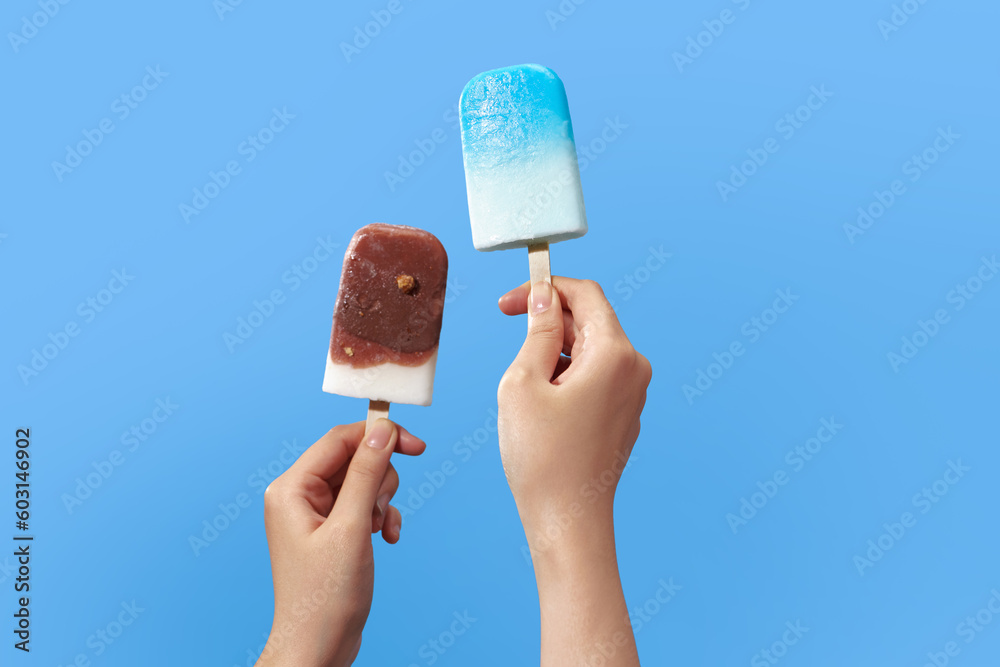 left and right hand holding Popsicle sticks isolated on white. Stock ...