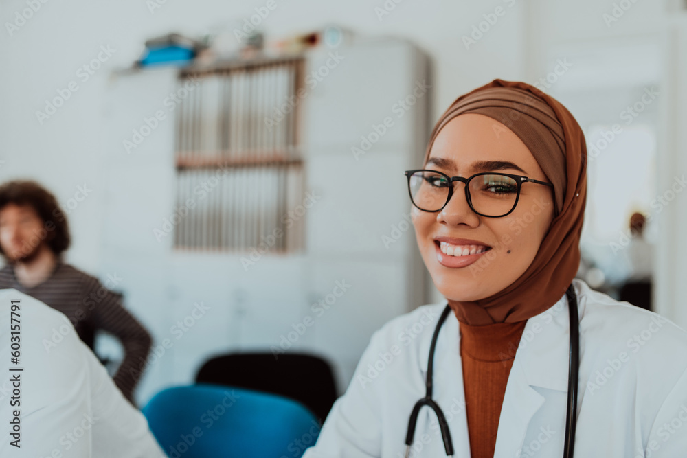 In a modern meeting room, a Muslim female doctor wearing a hijab ...