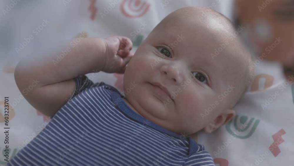 3 Month Old Baby On Back Above While Giving Smirk Smile. slow motion ...