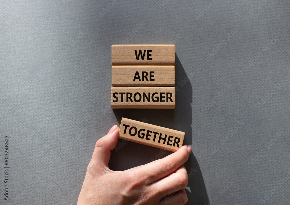 We are stronger together symbol. Wooden blocks with words We are ...