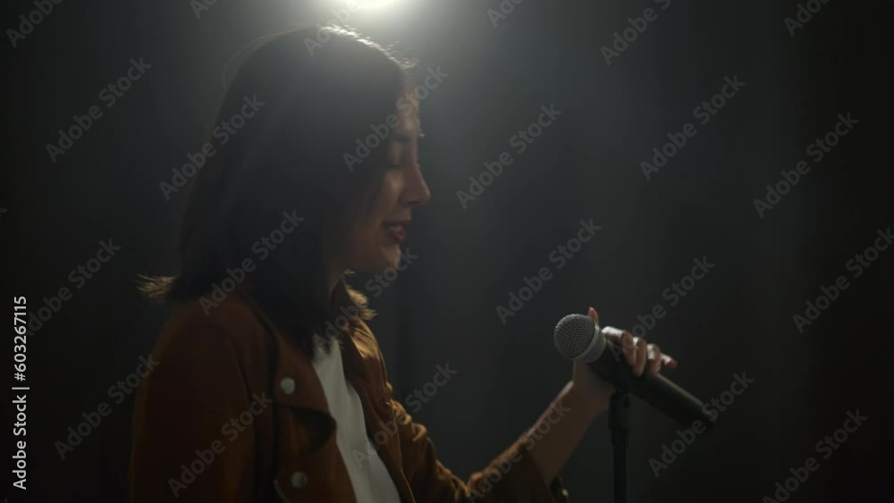 Wideo Stock: Attractive singer woman singing music and goodbye on stage ...