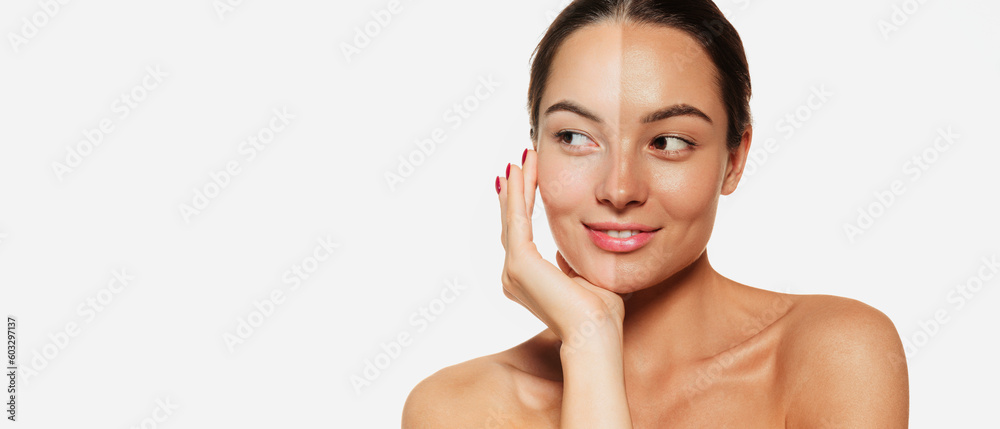 Beautiful woman, girl smiling with half tanned face over white studio ...