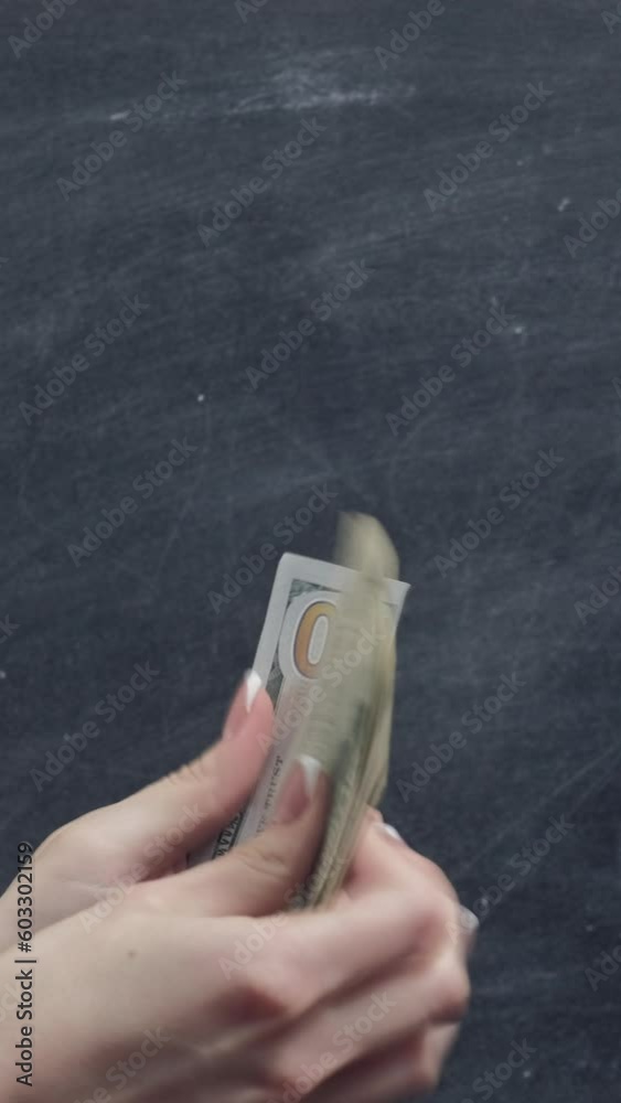 Vertical video. Family finances. Sharing money. Husband and wife hands ...