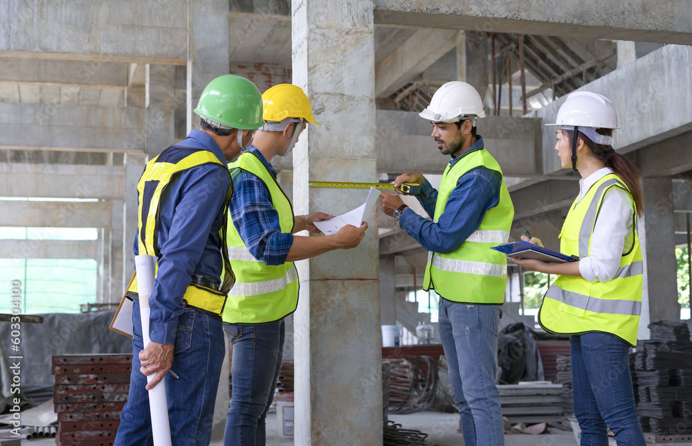 engineer project manager measuring a pillar with tape measure,engineers ...