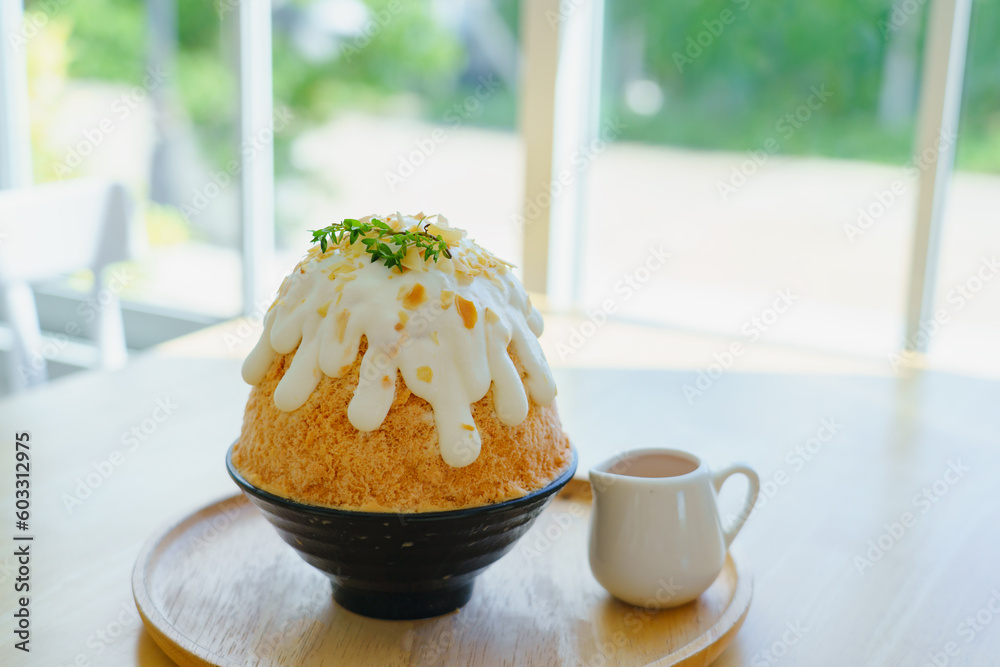 Japanese shaved ice dessert , milk tea kakigori bingsu topped with ...