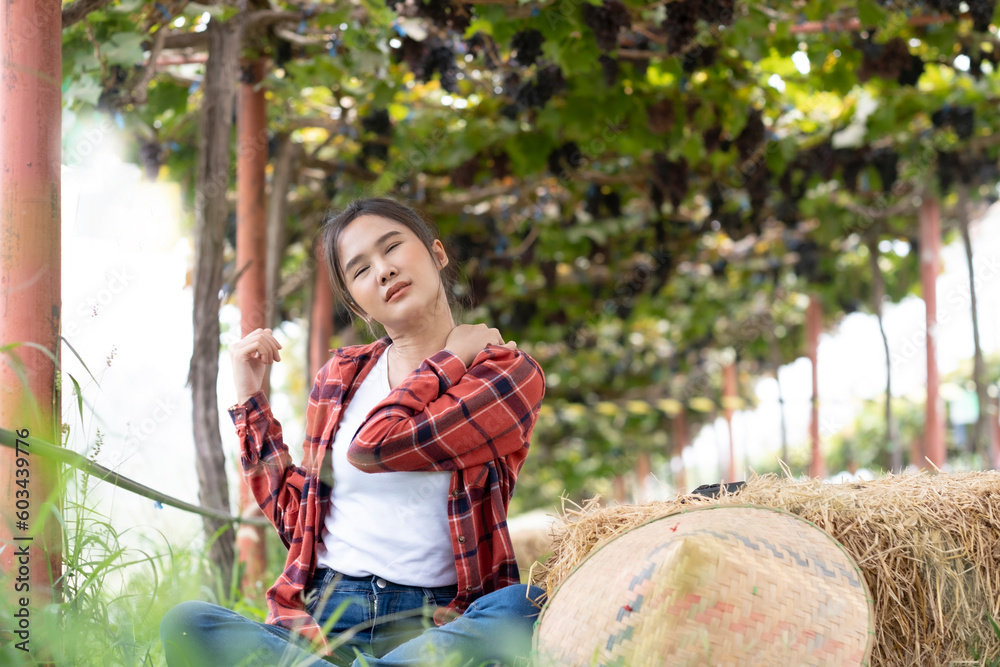 Asian beautiful farmer got pain at her shoulder after working in farm ...