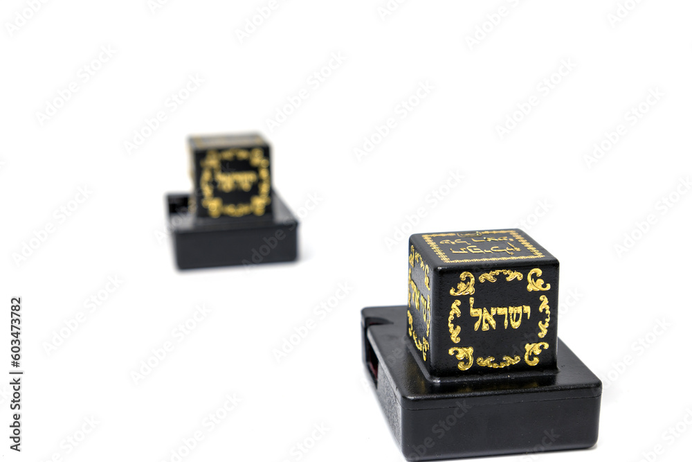 Tefillin or phylacteries . Pair of black leather boxes for the arm and ...