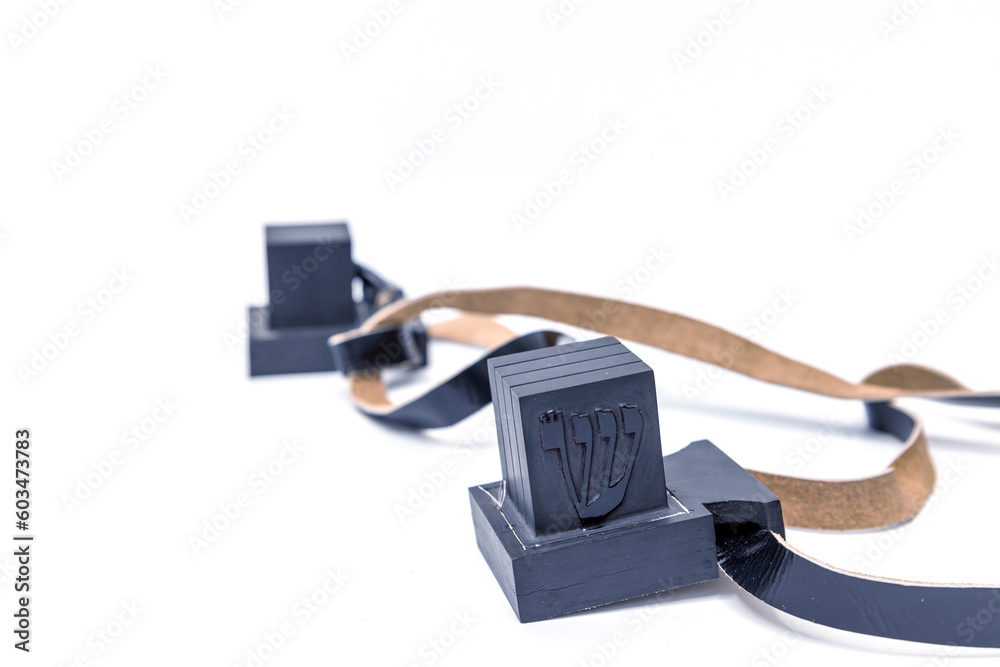 Tefillin or phylacteries . Pair of black leather boxes for the arm and ...