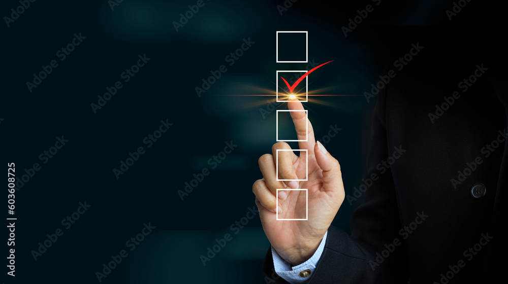 Checking mark on checklist with a red marker on dark background Stock ...